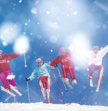 People jumping happily with skis (old slide)